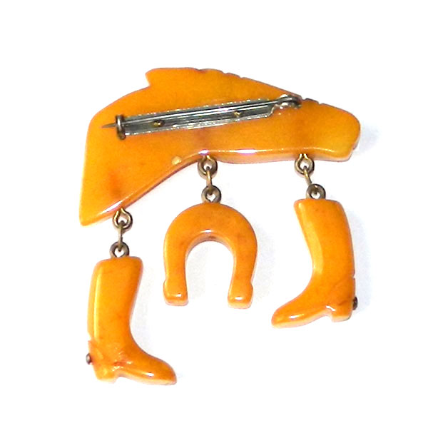 Hand carved bakelite horse head brooch